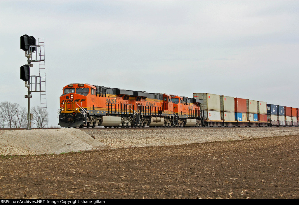 BNSF 7029 Heads off Wb with a stack train in tow.